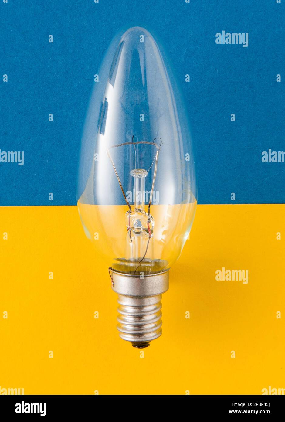 An old glass electric light bulb with a tungsten filament. The concept ...