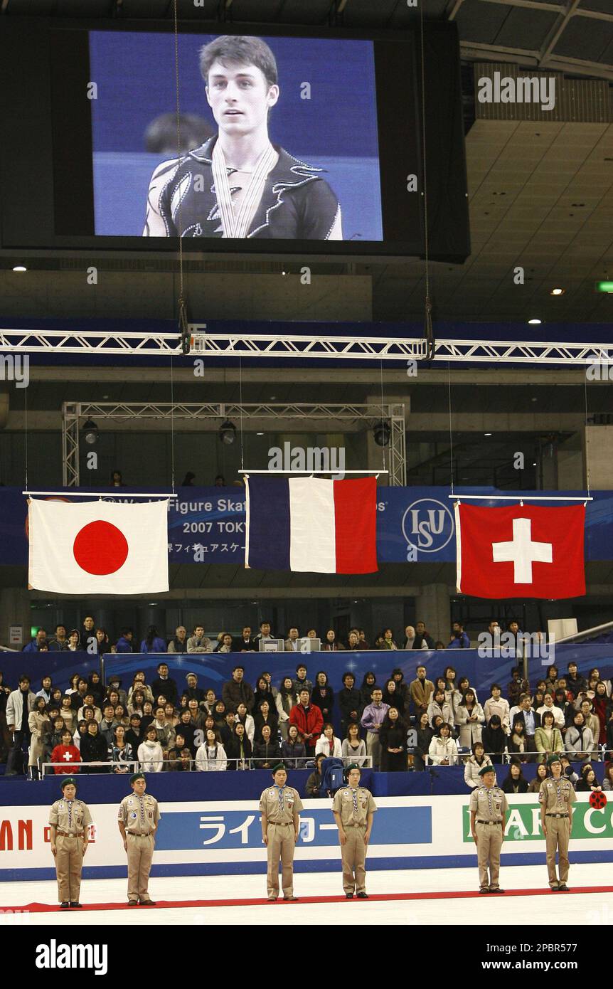 France's gold medalist Brian Joubert is shown in a giant screen as his ...