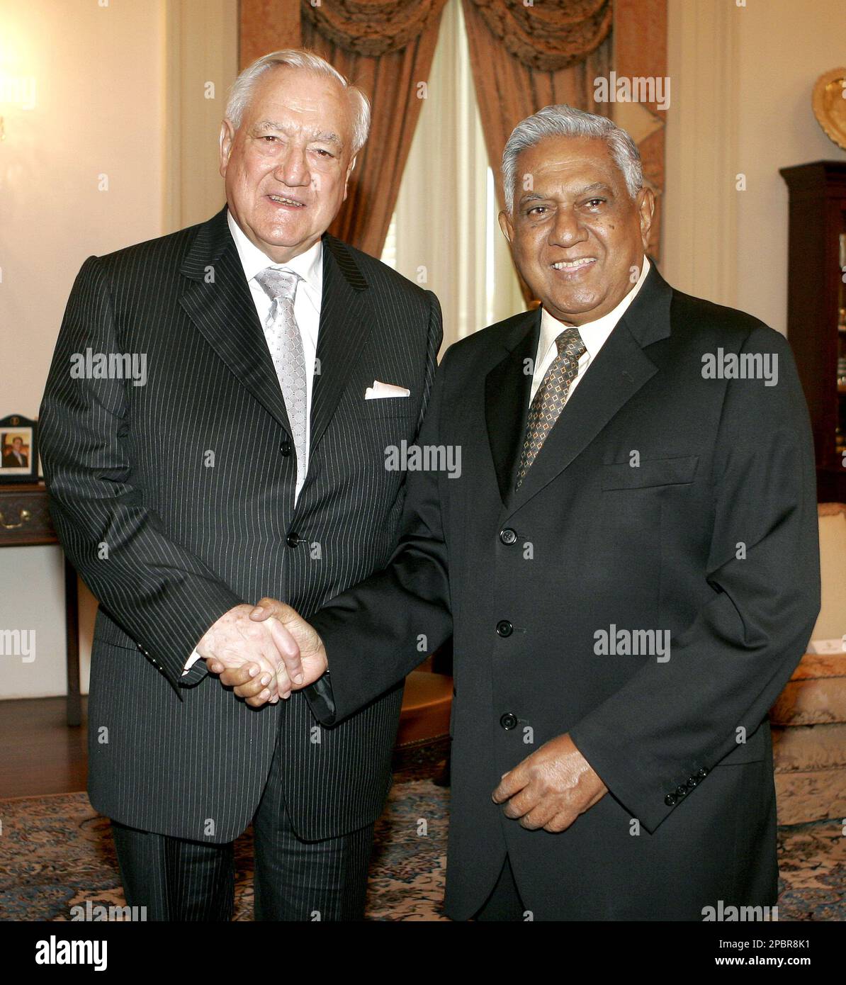 President of the French Senate, Christian Poncelet, left, shakes hands ...