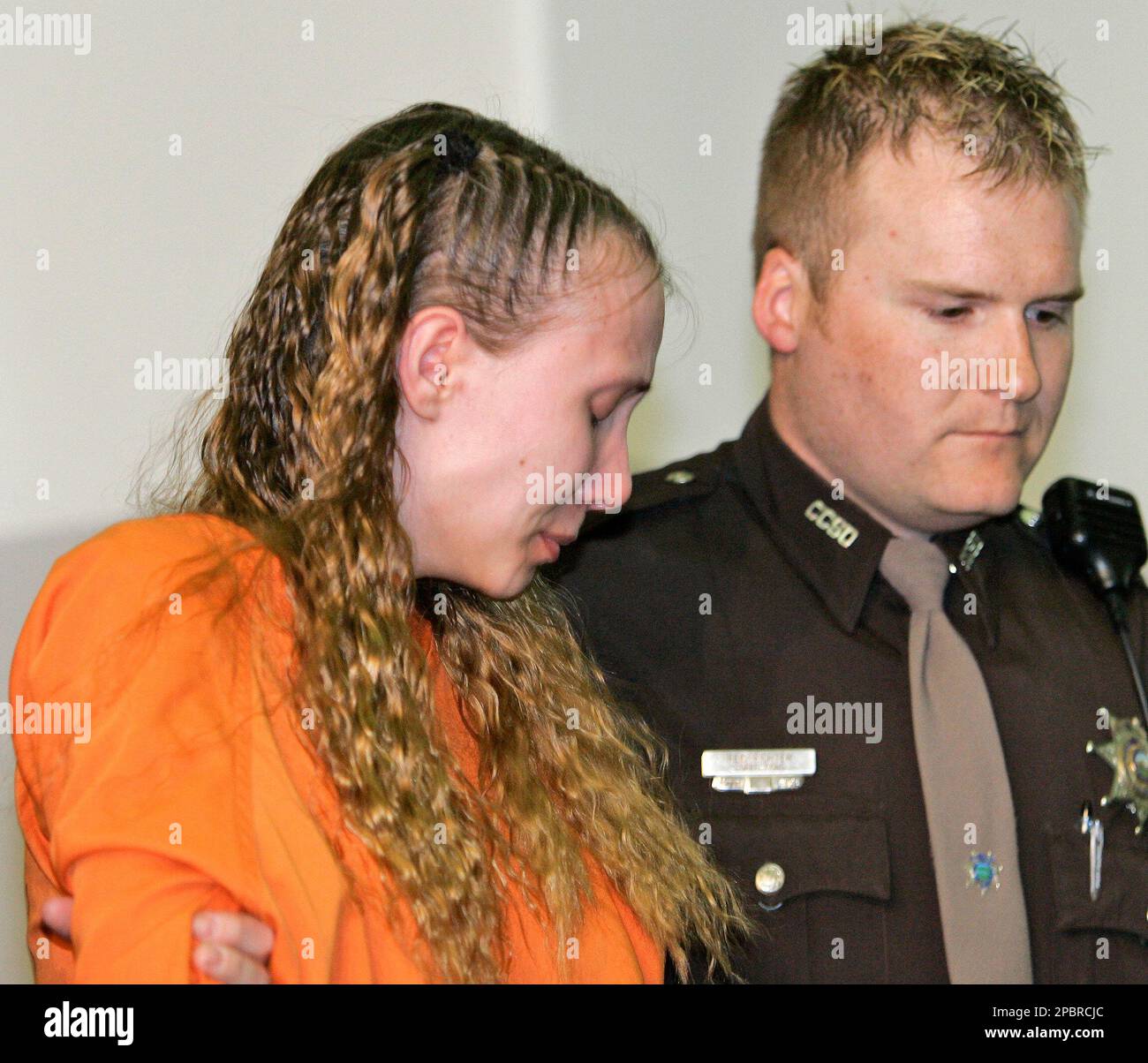Eighteen-year-old Jessica Reid, left, is led by sheriff's deputy Reid ...