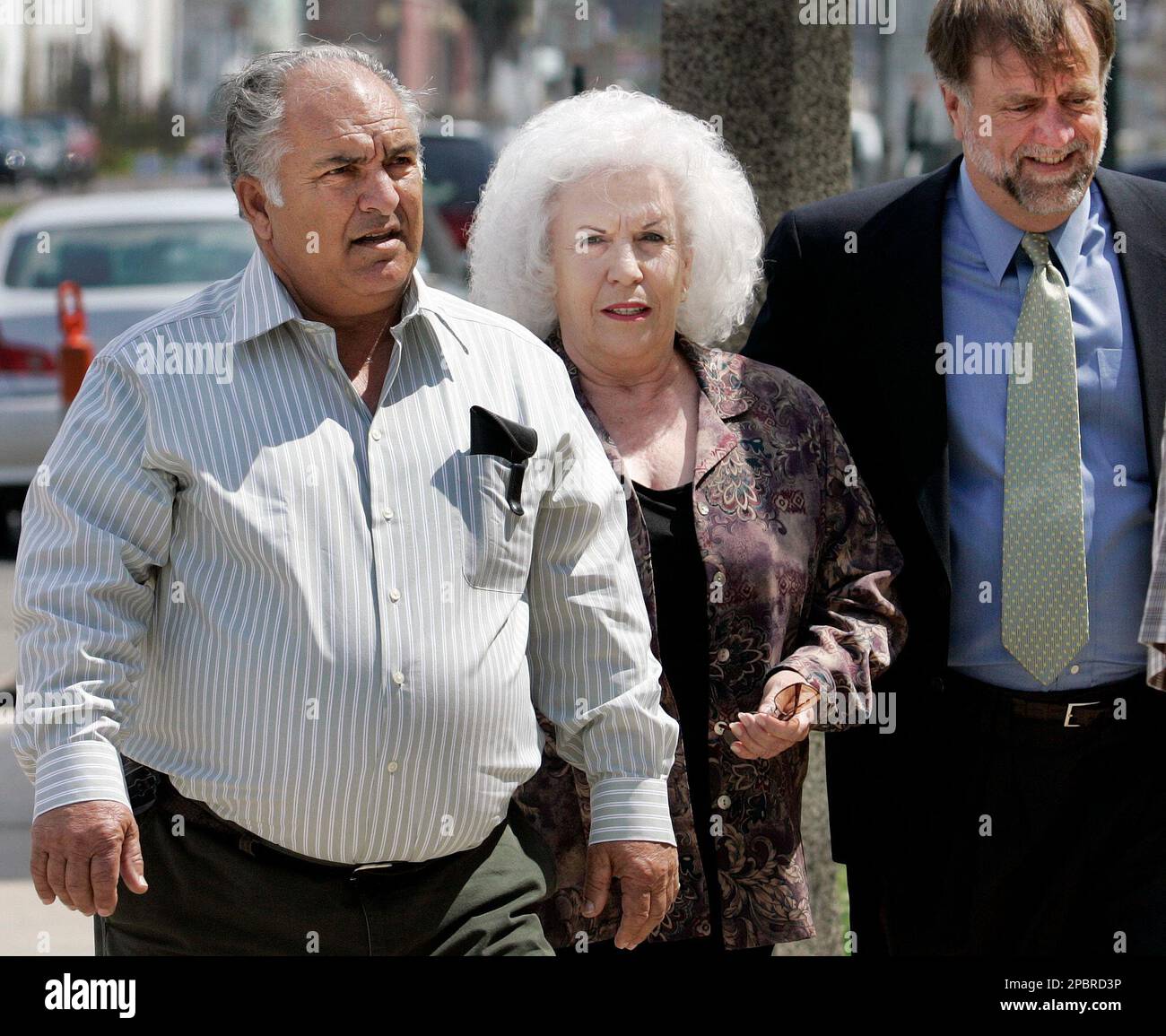 Salvador Mangano, left, and his wife, Mable, along with attorney James ...