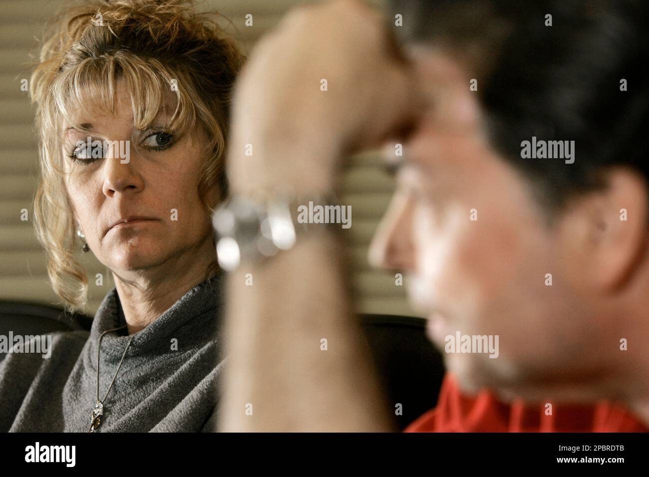 Debbi Heiss, left, looks at former Brookfield Township police detective ...