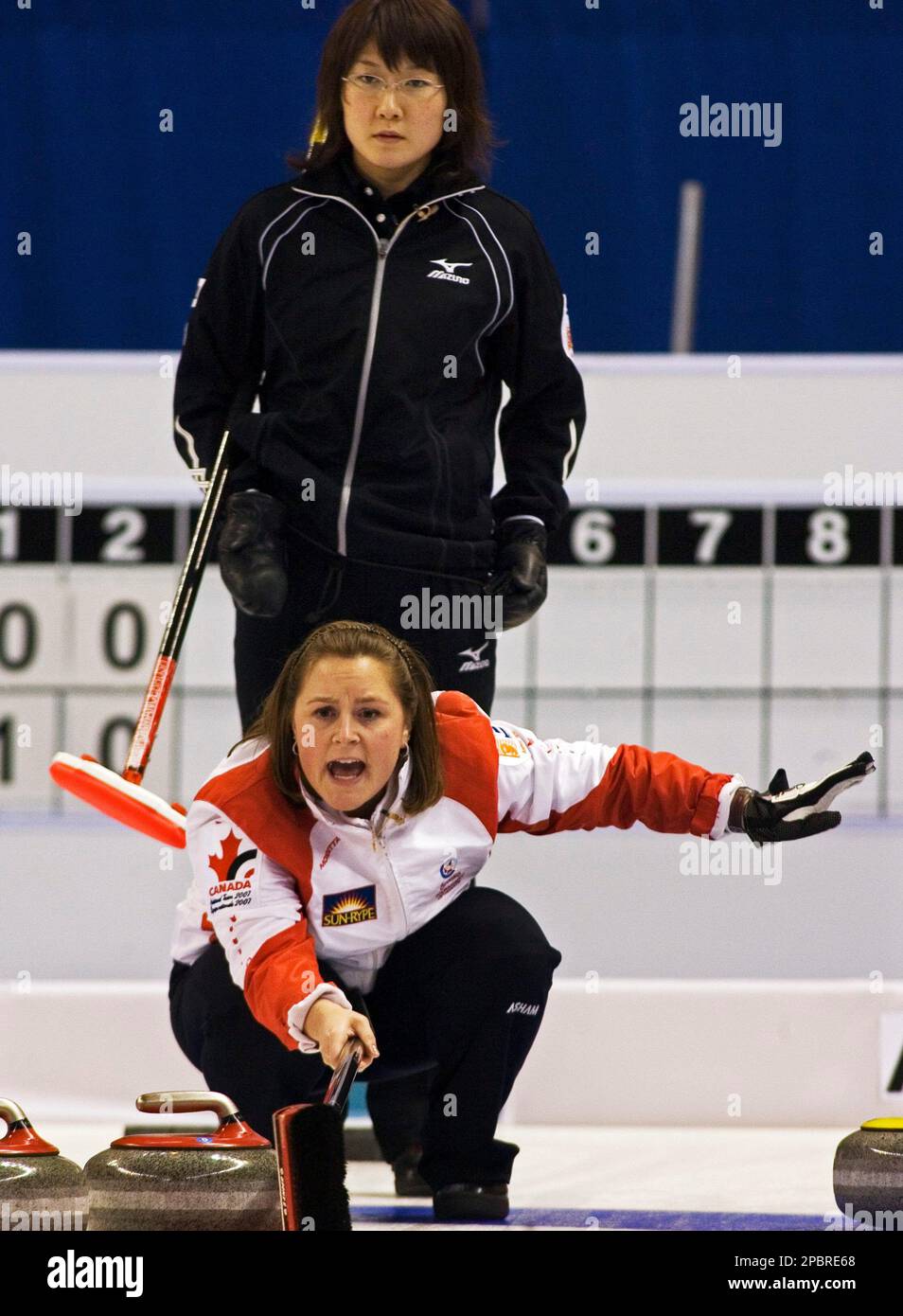 Team Canada skip Kelly Scott call the sweep as Japan skip Moe Meguro ...