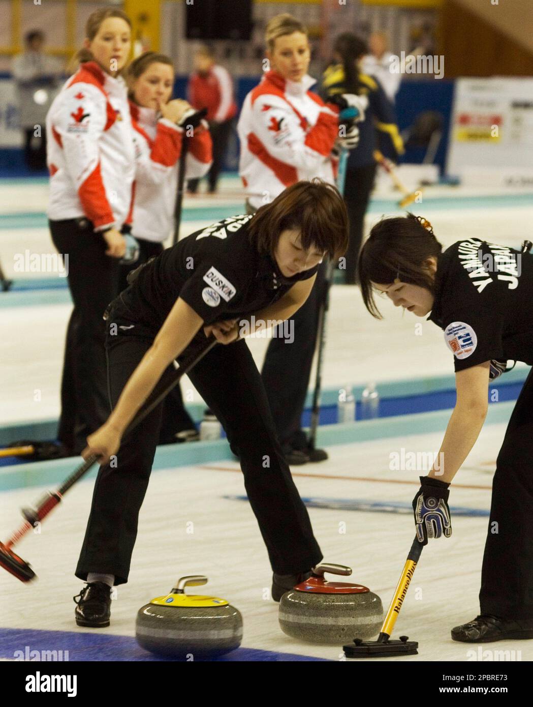 Team Canada skip Kelly Scott, flanked by Renee Simons, left, and Sasha ...