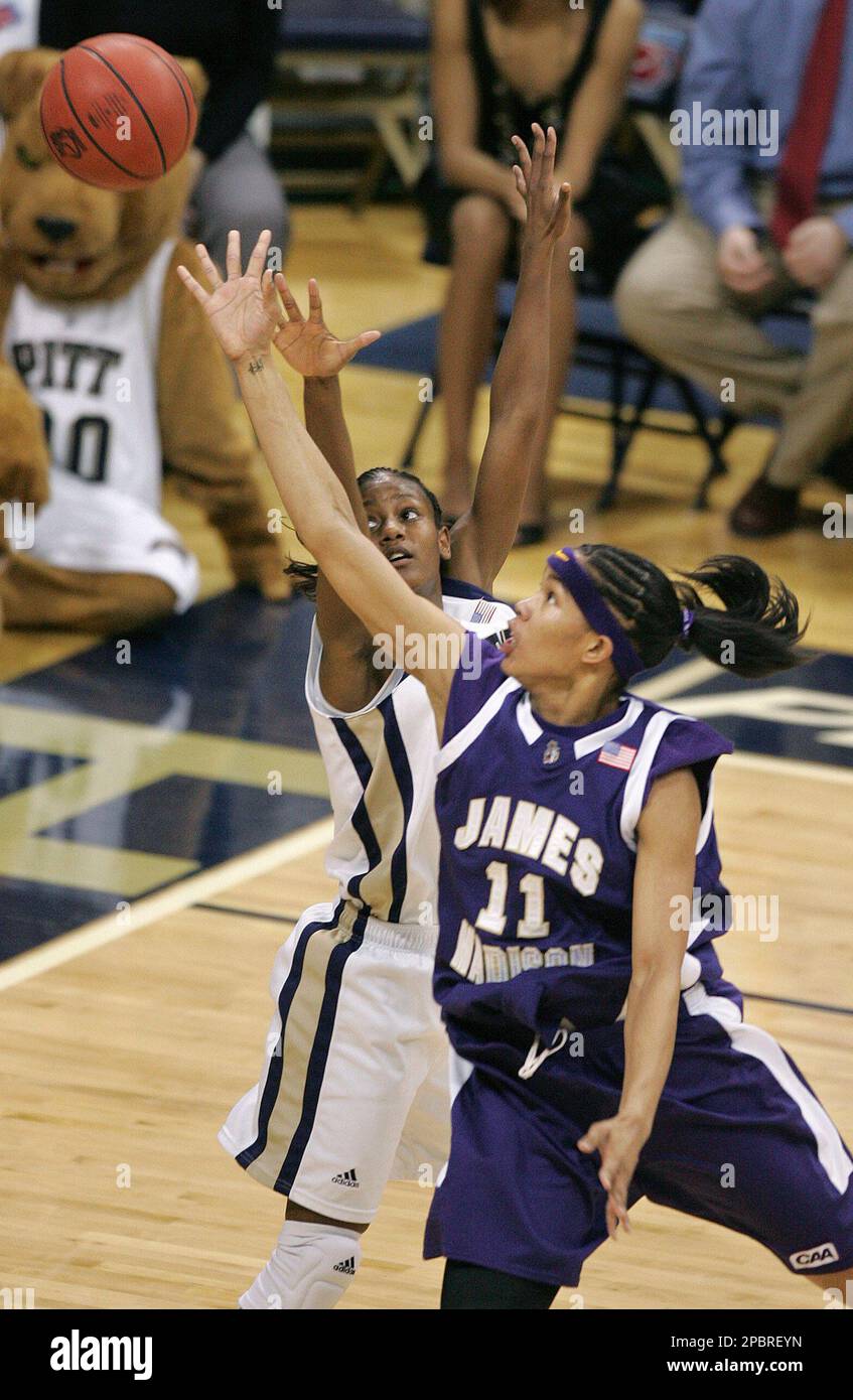 James Madison's Tamera Young shoots over Pittsburgh's Jania Sims in the ...