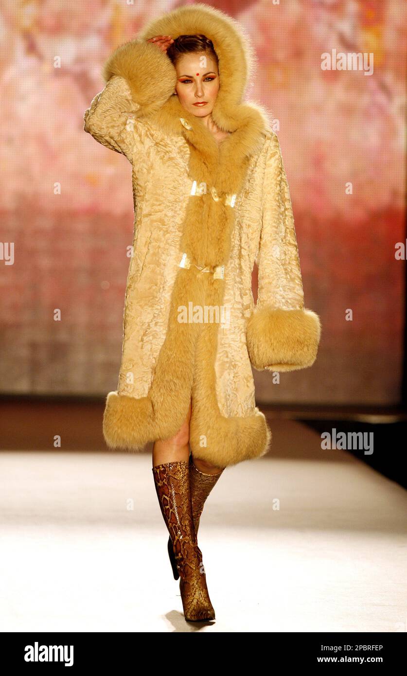 A model presents an outfit by Greek designers Nikos and Takis during a ...