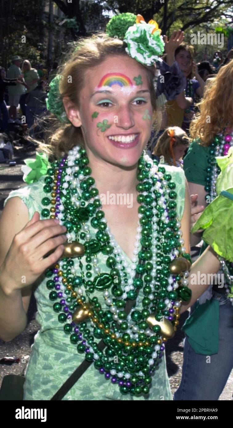 Loyola student Willy Peragine is decked out with her face painted and ...
