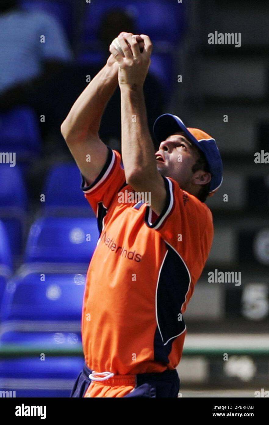 Netherlands' Peter Borren catches out Australia's opening batsman ...
