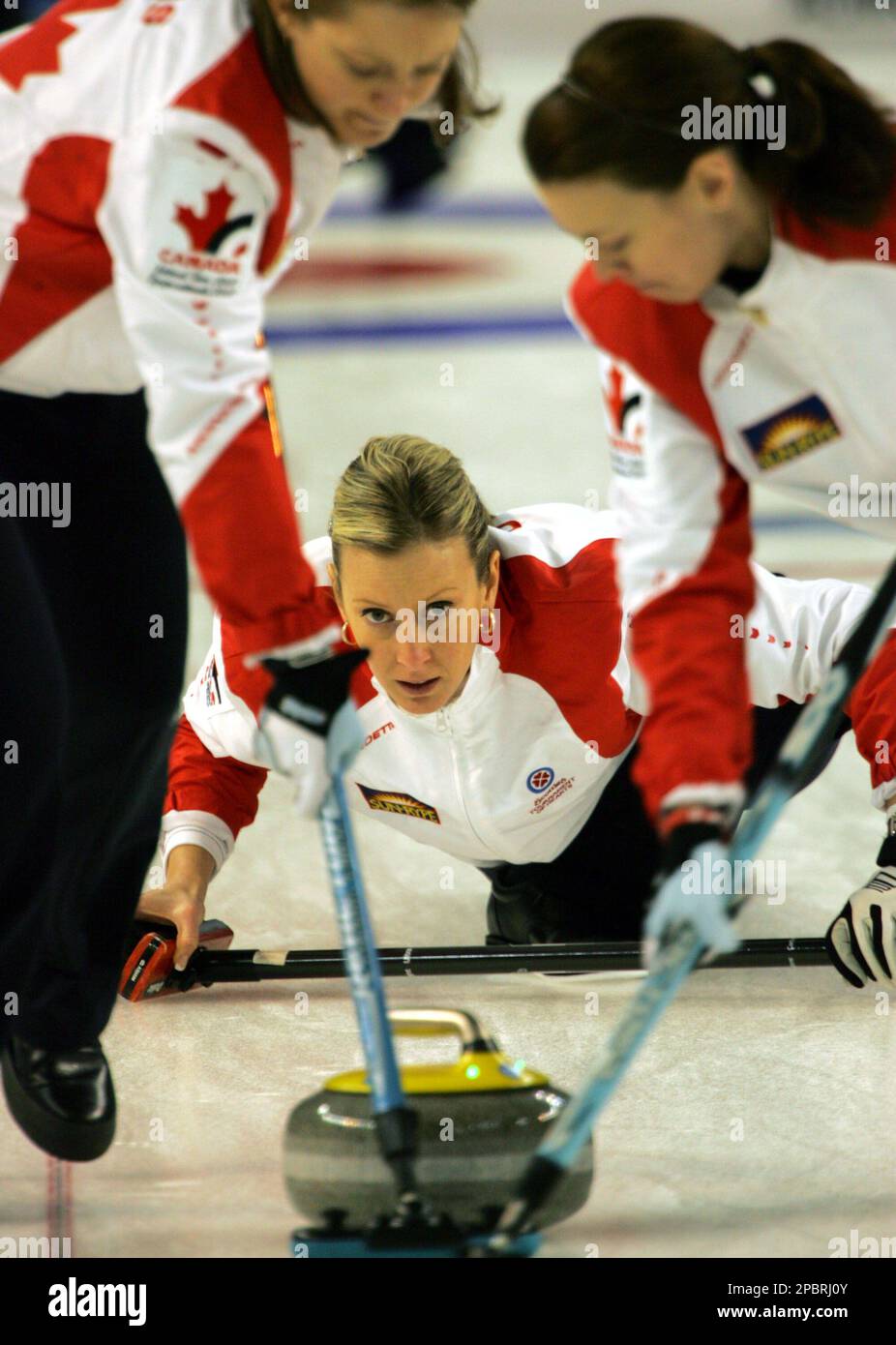 Team Canada's second Sasha Carter, center, watches as teammates Renee ...