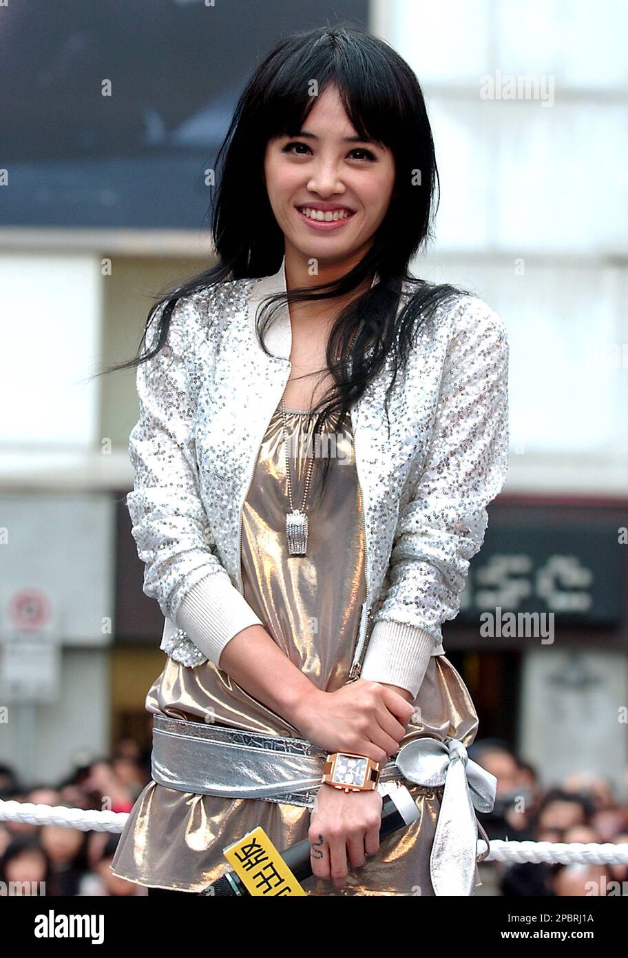 Famed Taiwan singer Jolin poses for photographers during an event to ...