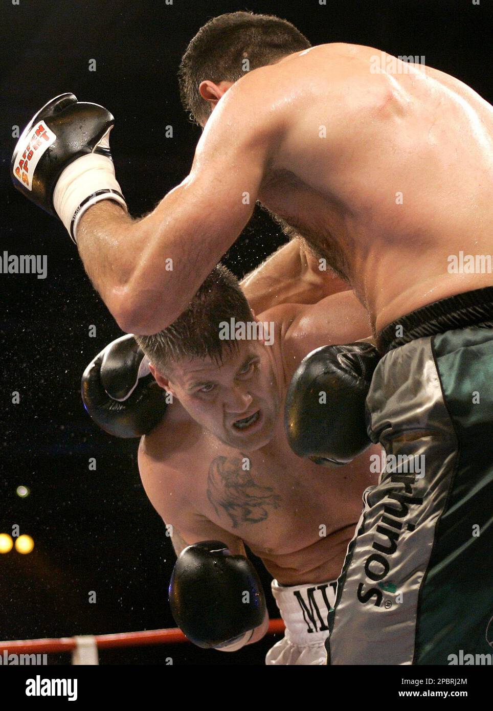 German boxer Luan Krasniqi, right, punches Brian Minto from the USA in ...