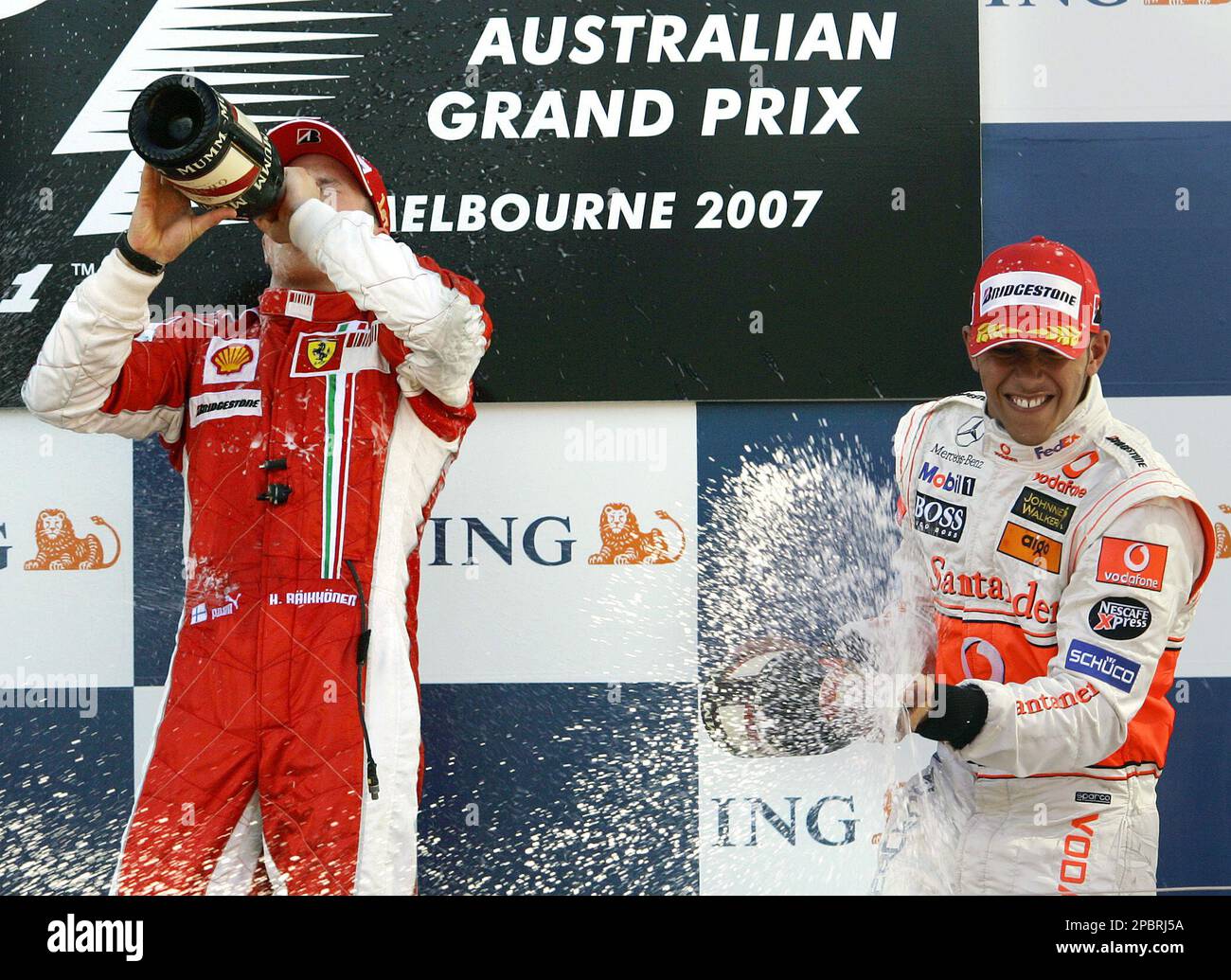 British Formula One driver Lewis Hamilton, right, celebrates his third ...