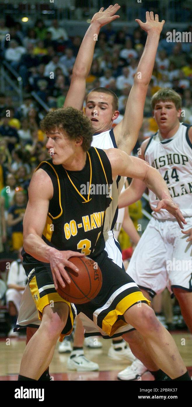 Sioux City Bishop Heelan's Mike Bisenius defends against Waverly Shell ...