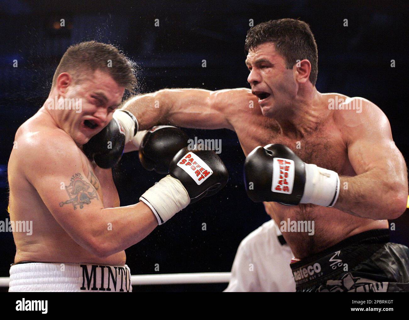 German boxer Luan Krasniqi, right, punches Brian Minto from the USA ...
