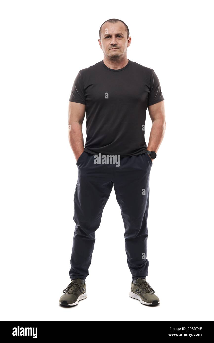 Full body of a mature fitness coach posing on white background Stock ...