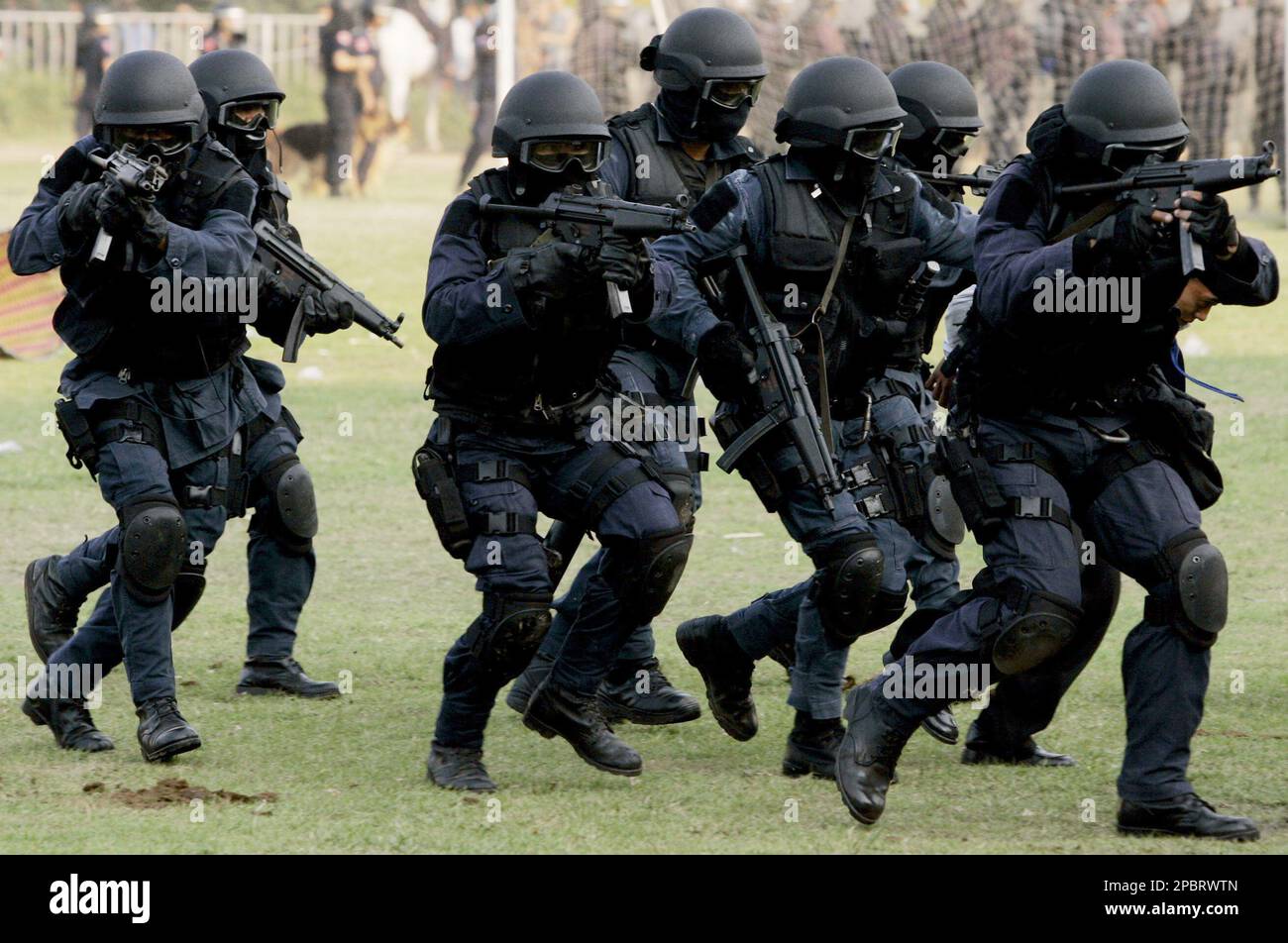 Thai commando unit move in during a save the hostage demonstration at a ...