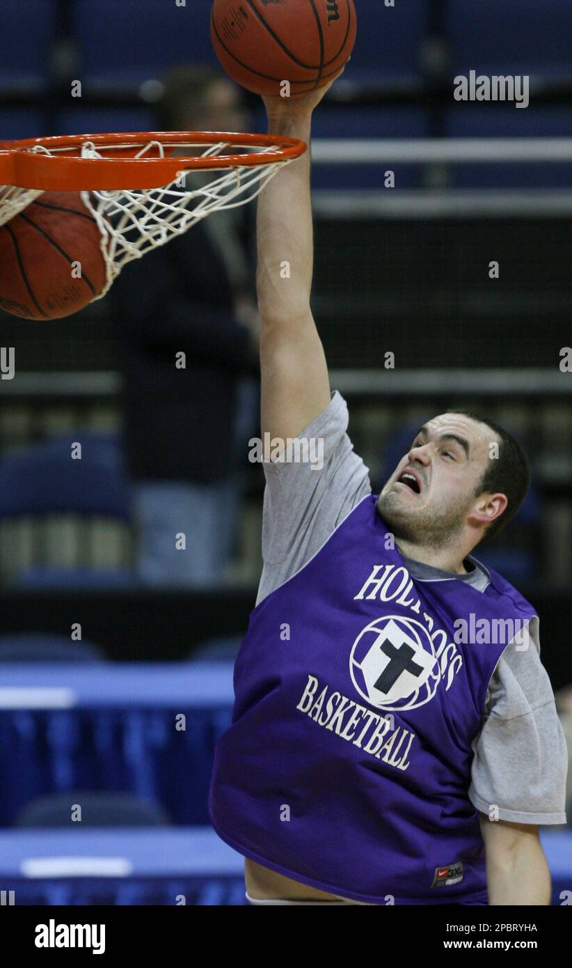 Holy Cross center Tim Clifford goes up for a dunk Thursday, March 15 ...