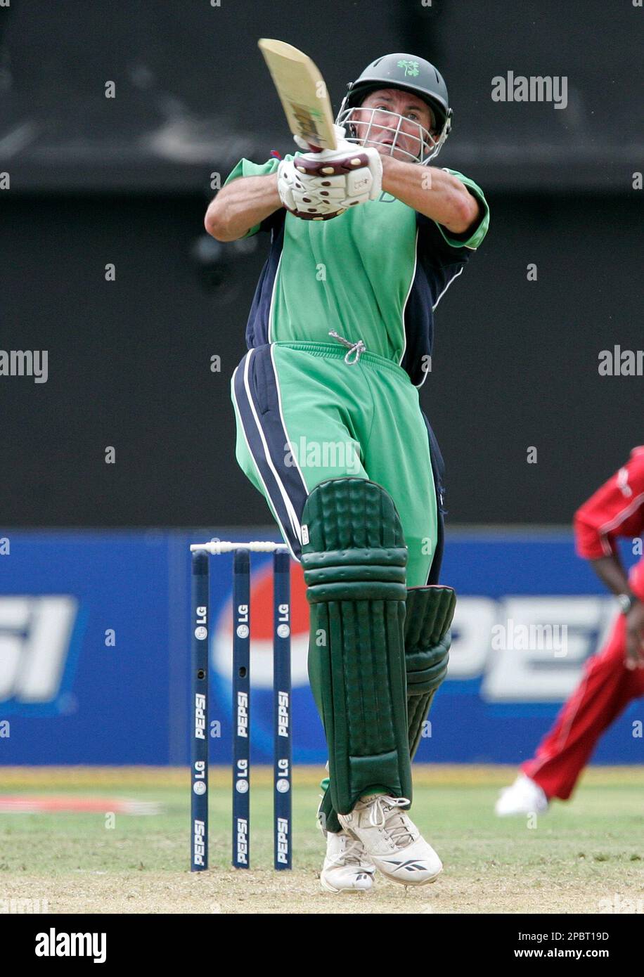 Ireland's Jeremy Bray hits a boundary shot off Zimbabwe's Edward ...