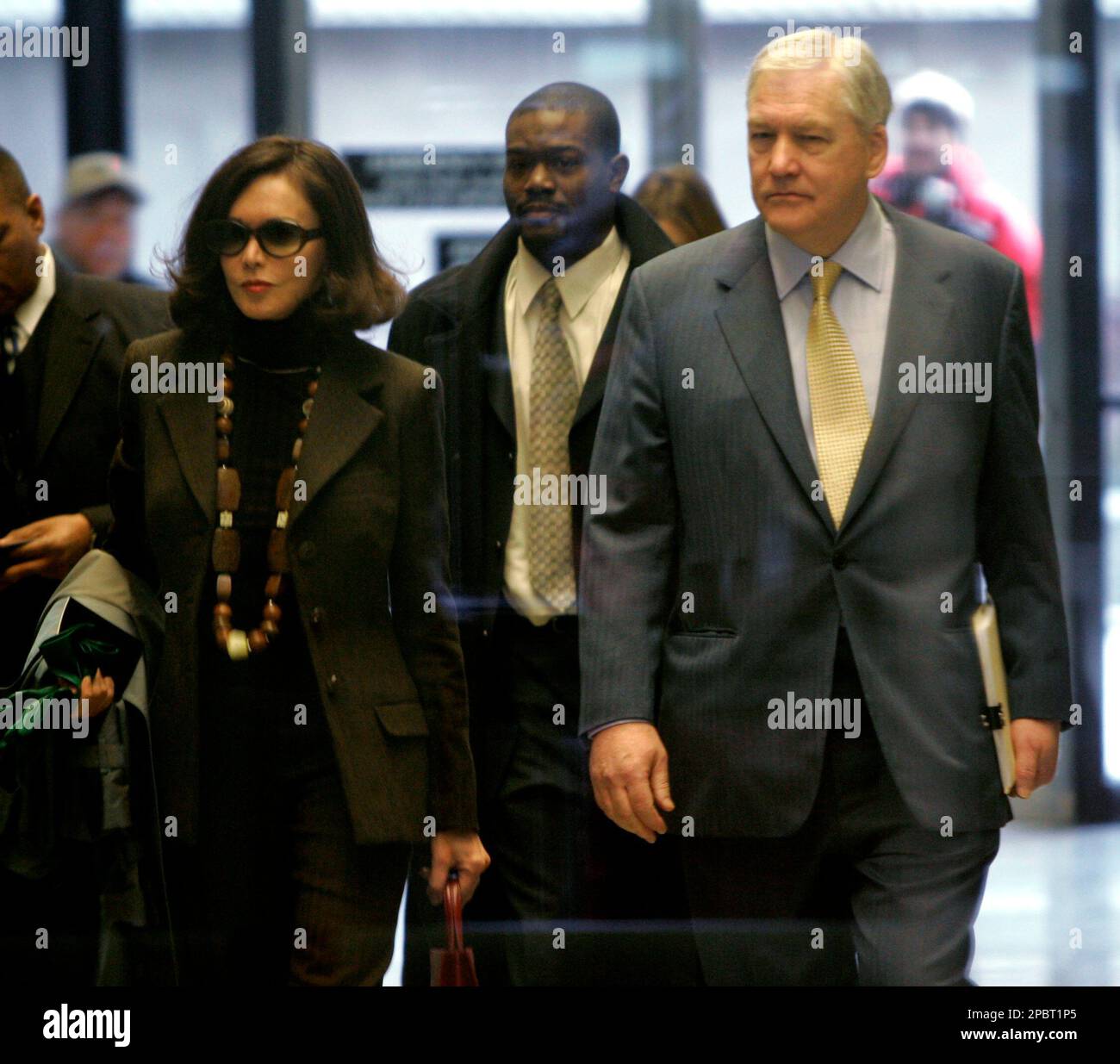 Conrad Black, right, arrives at the federal court building with his ...