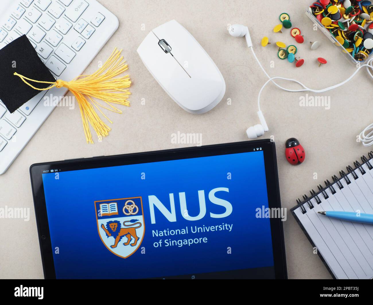 In this photo illustration, National University of Singapore (NUS) logo seen displayed on a ...