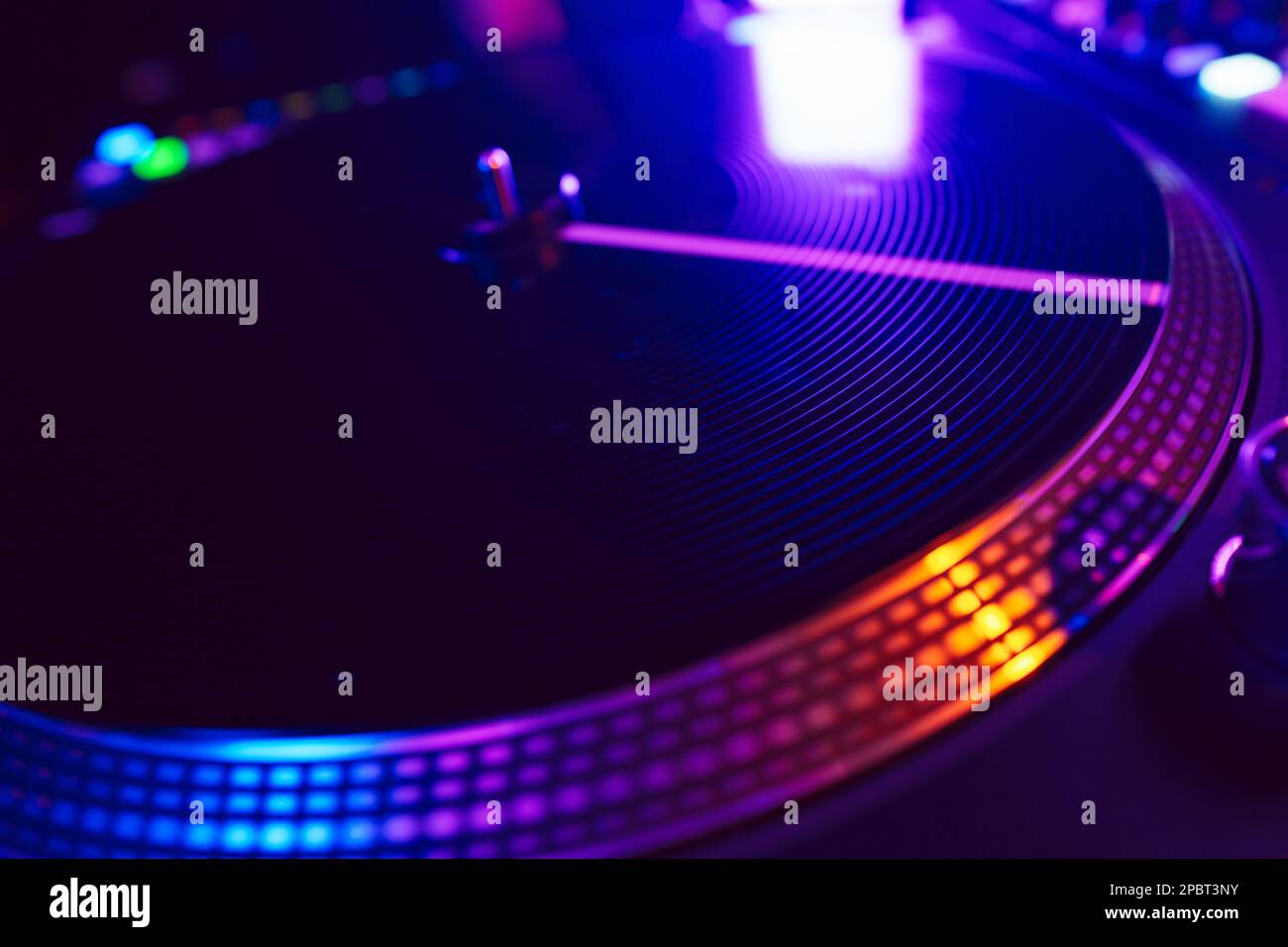 Close up of DJ mixing console in party light Stock Photo - Alamy