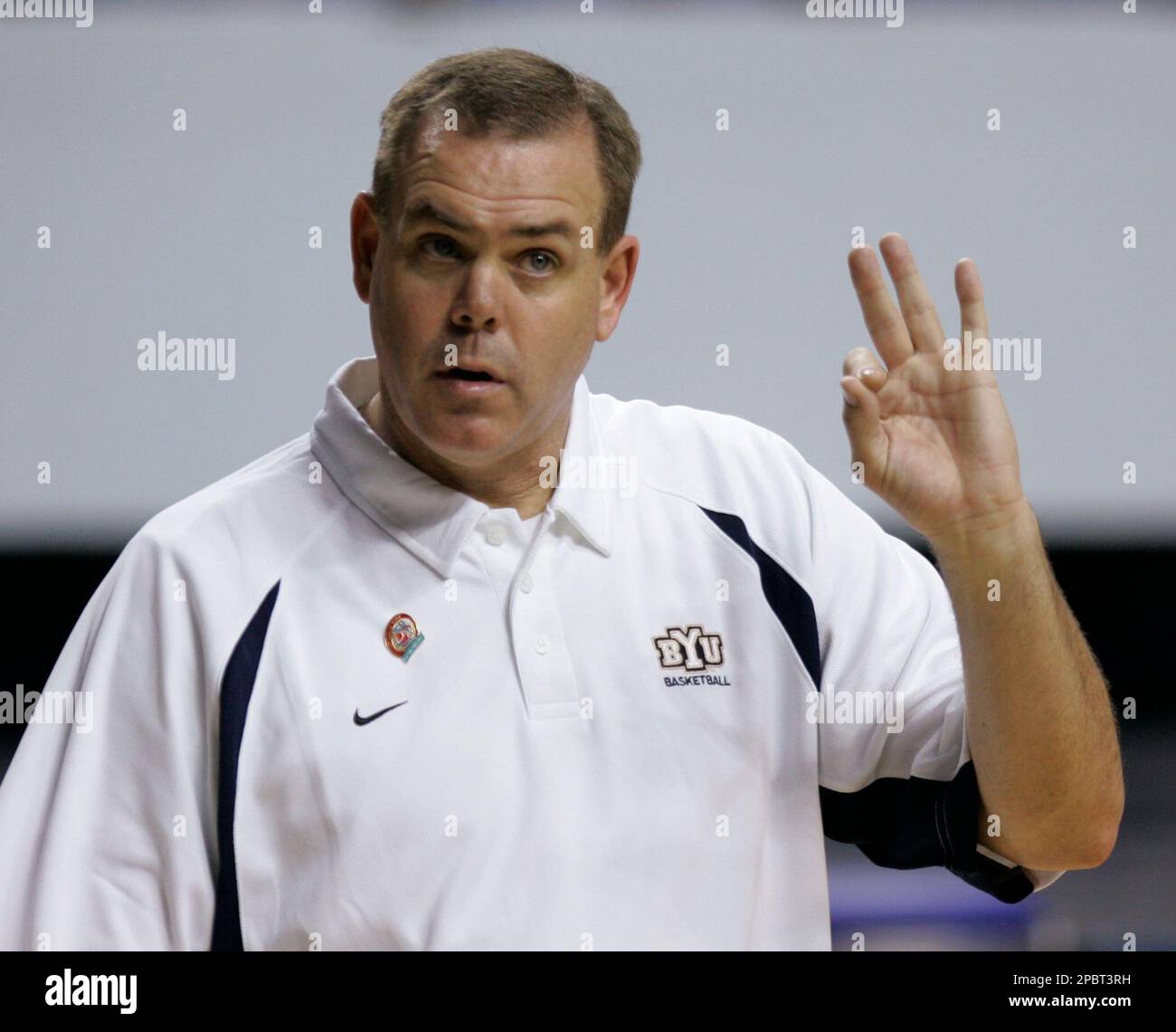 Brigham Young basketball coach Dave Rose gives instructions to his team ...