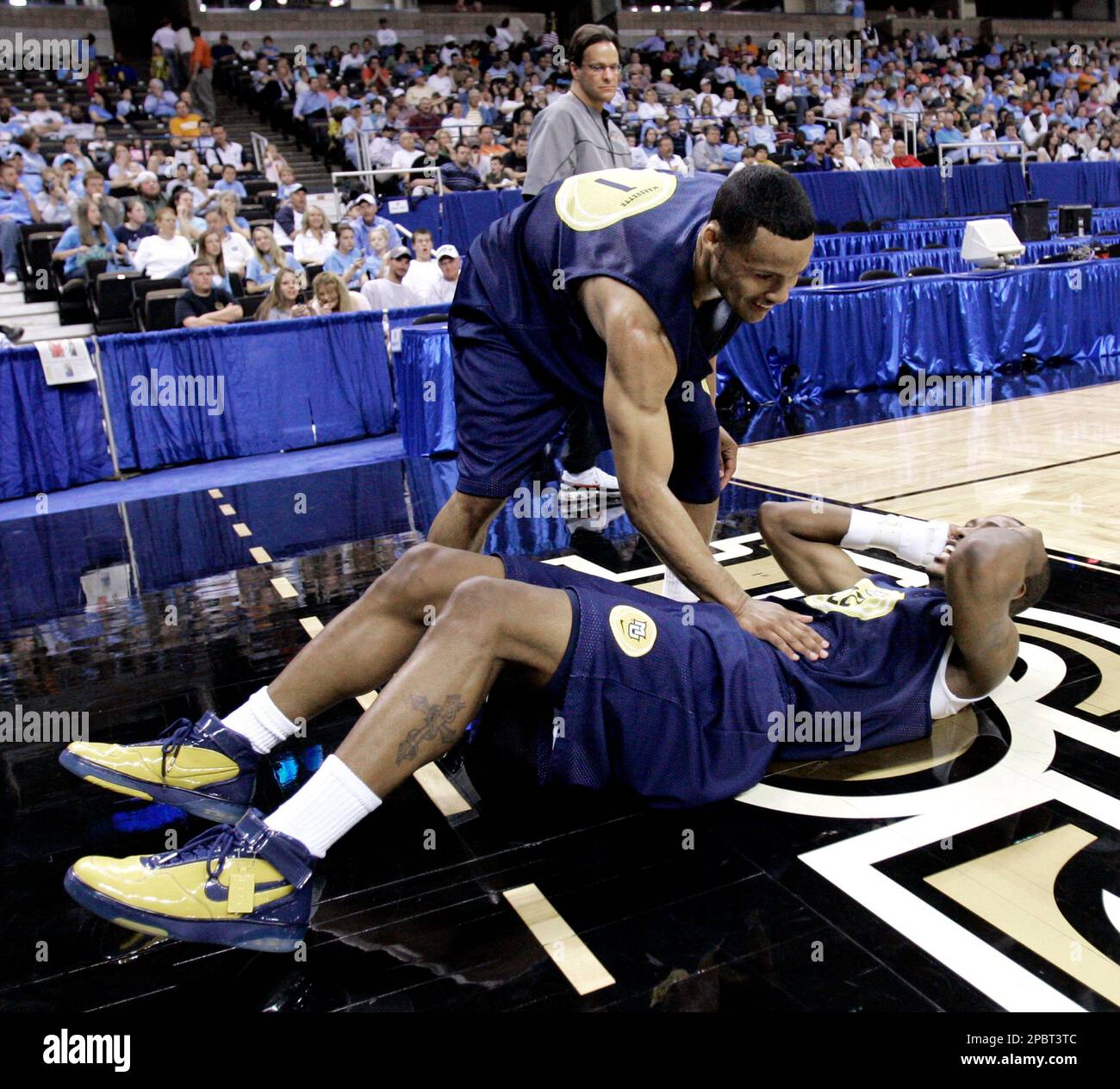 Marquette guard Dominic James (1) jokes with teammate Jerel McNeal as ...