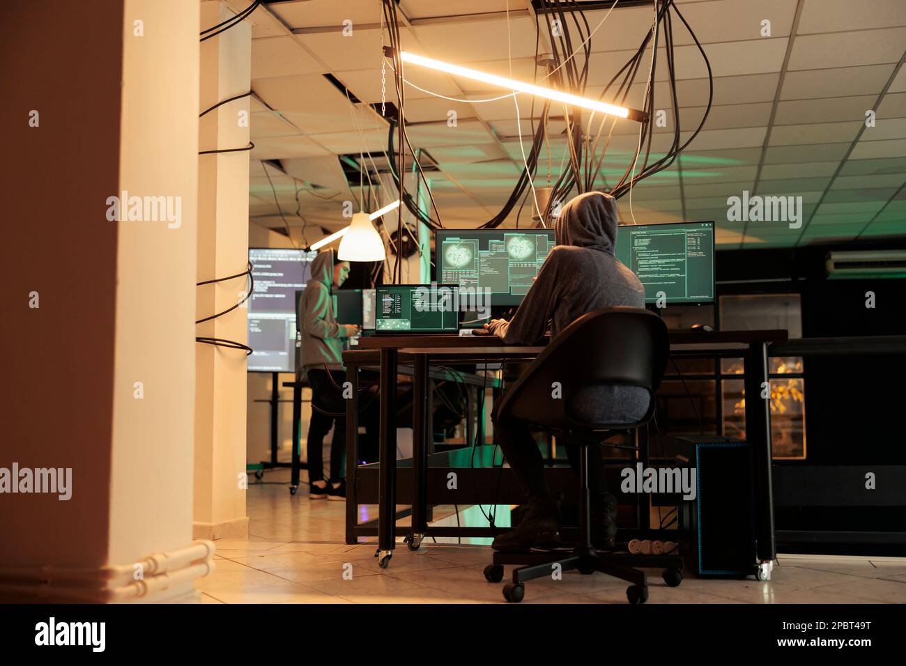 Young Hacker Cracking Firewall Encryption On Multi Monitors Writing Script And Programming