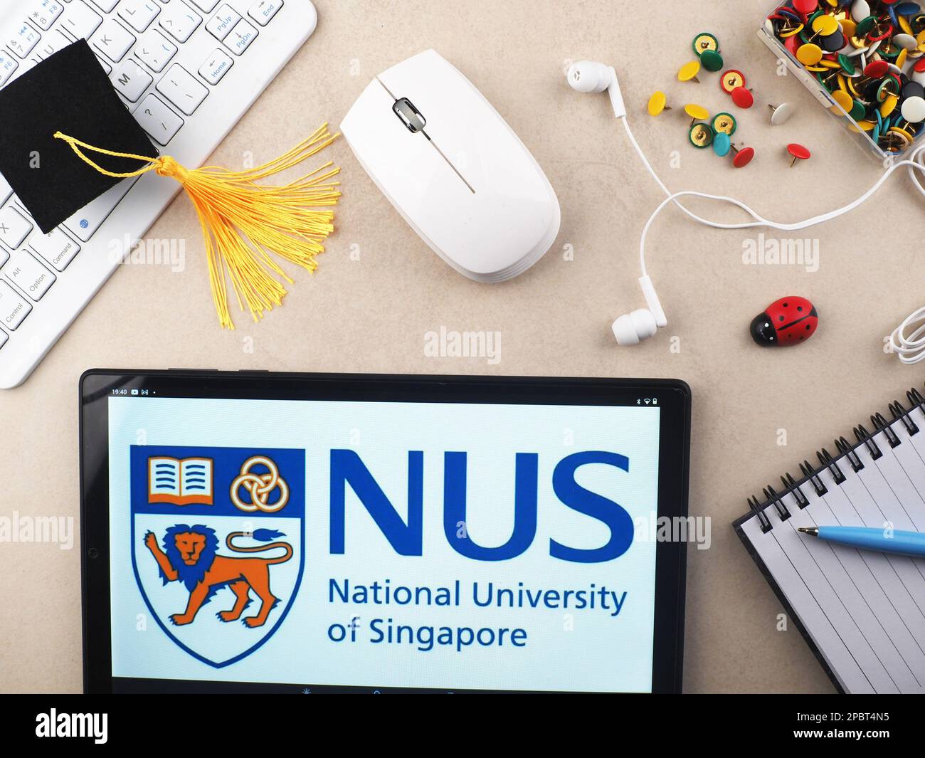 In this photo illustration, National University of Singapore (NUS) logo ...