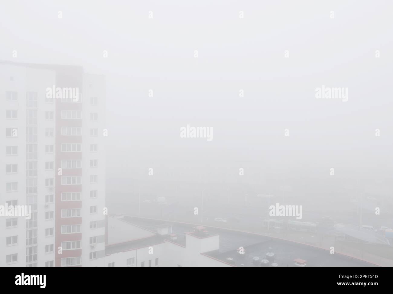 Windows of houses in the fog. City street glows in a foggy haze Stock ...