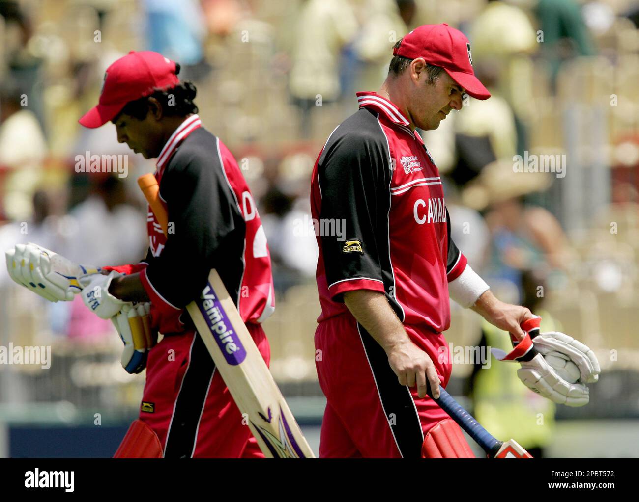 Canada's Ian Billcliff, right, passes his replacement Sanil Dhaniram as ...