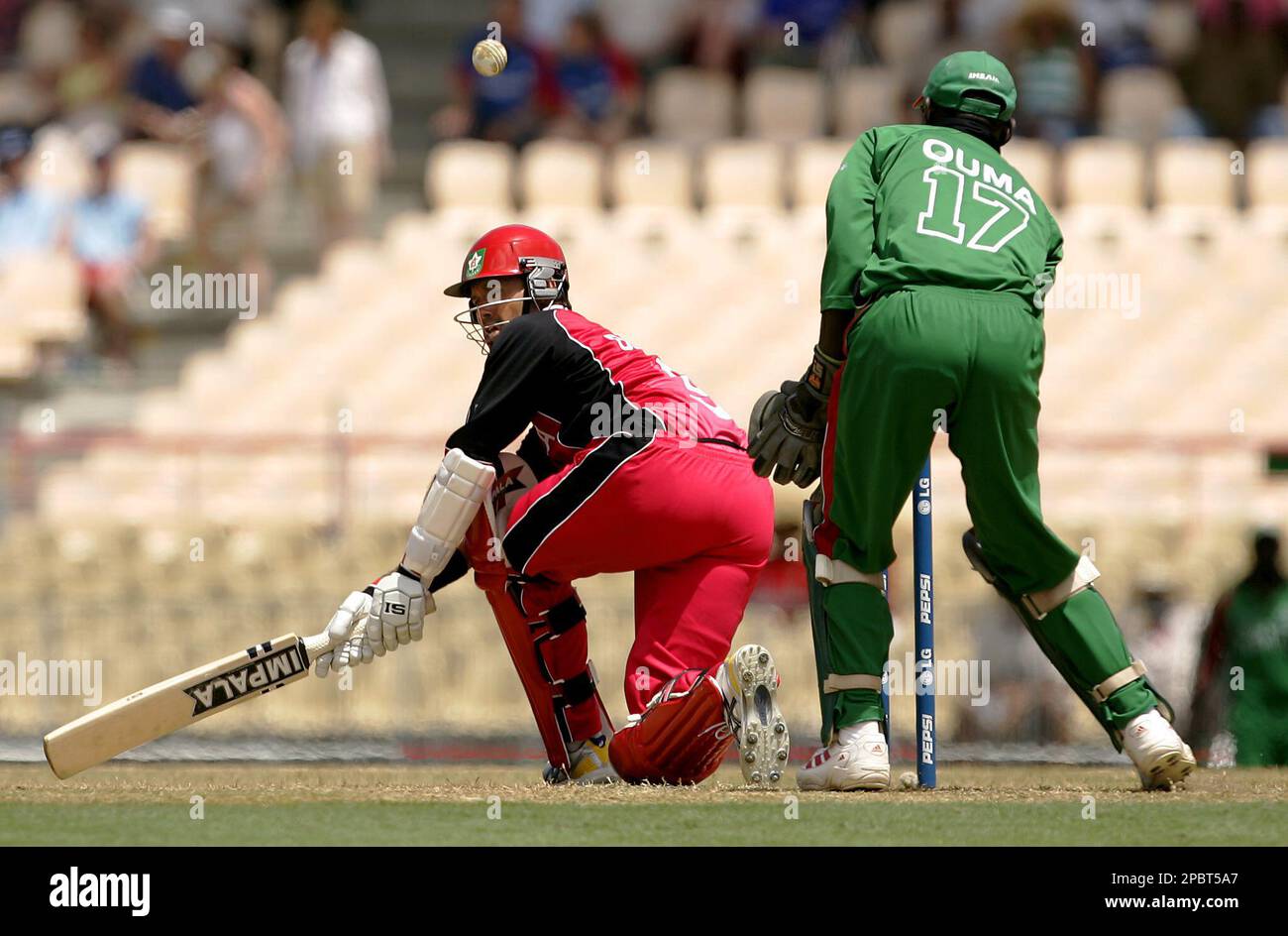 Canada's John Davison hits the ball past Kenya's wicketkeeper Morris ...