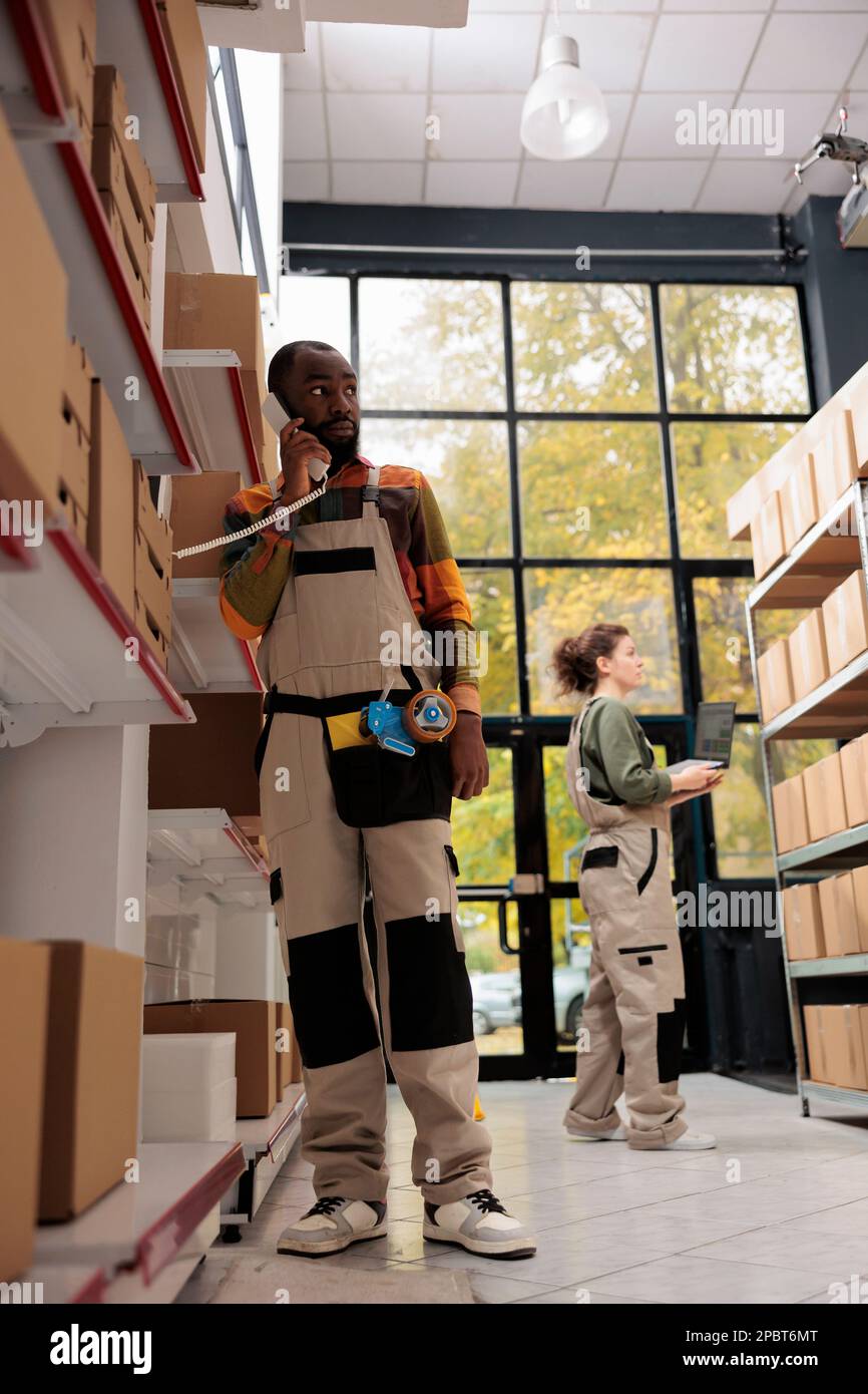 African american supervisor explaining delivery details to remote ...
