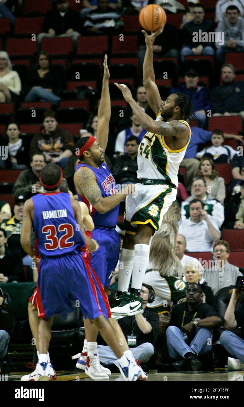Seattle SuperSonics' Chris Wilcox, right, shoots over Detroit Pistons ...