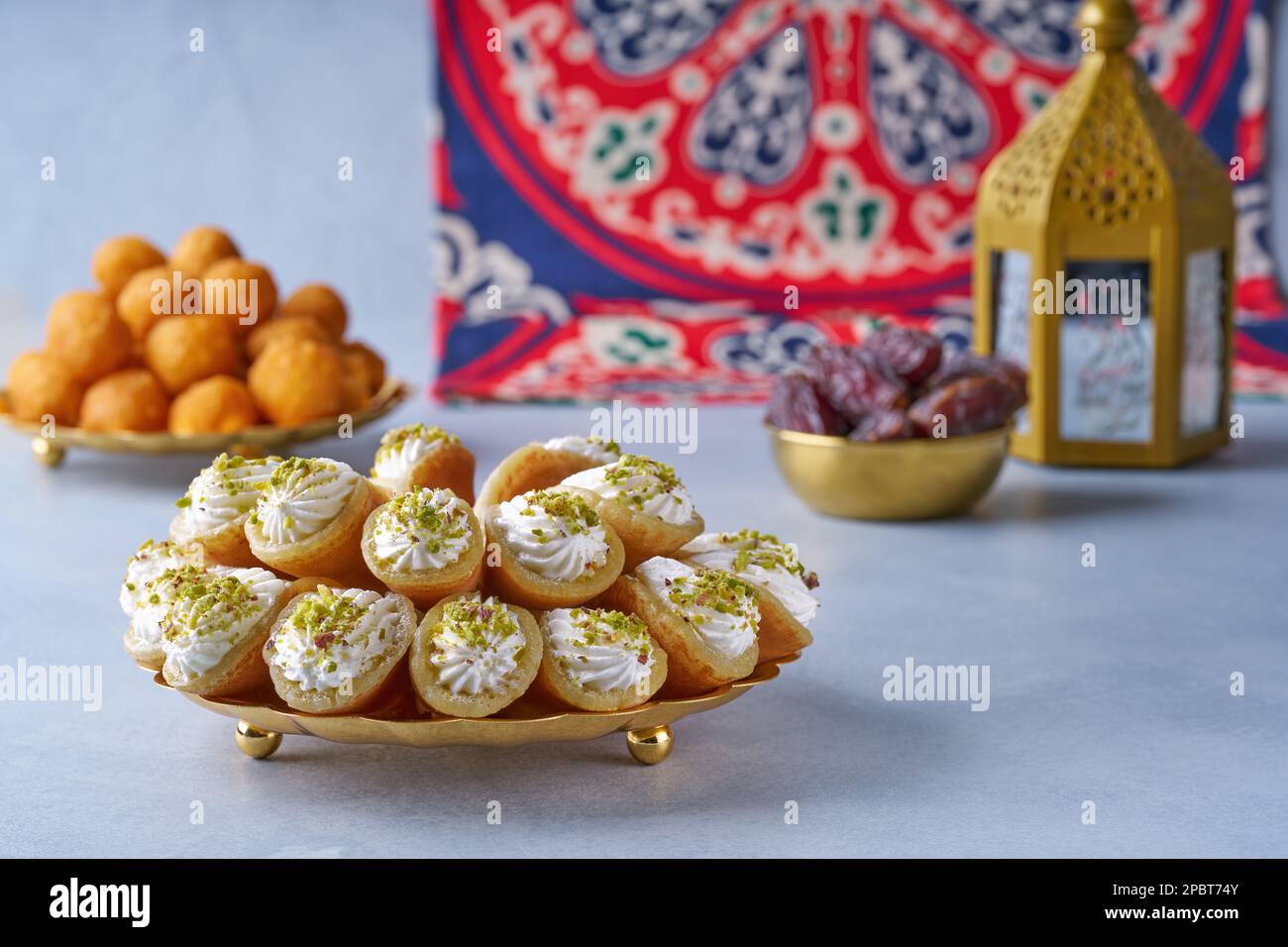 Arabian pancake Qatayef with qishta cream and pistachio . Traditional ...