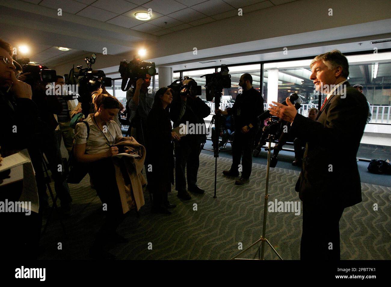 U.S. Rep. Martin Meehan, right, speaks to reporters at Logan ...