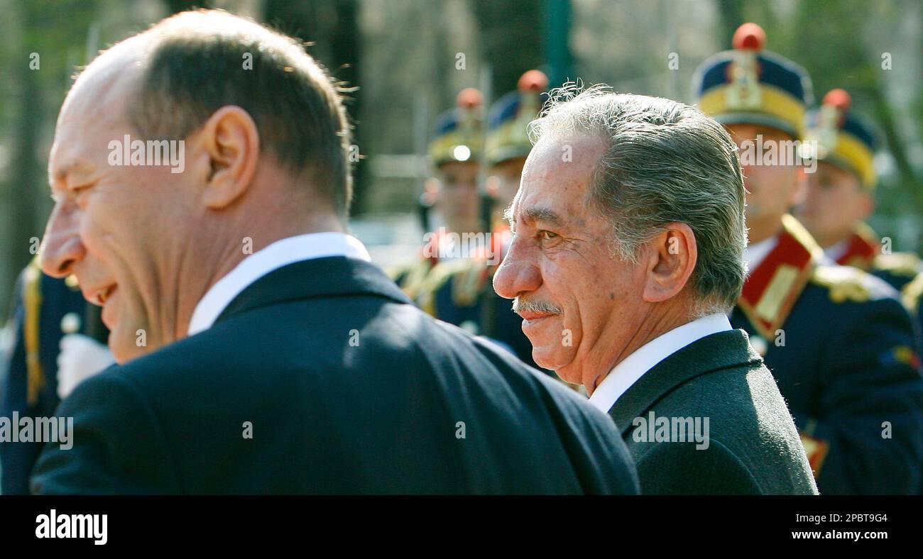 President of Cyprus Tassos Papadopoulos, right, looks on as Romanian ...
