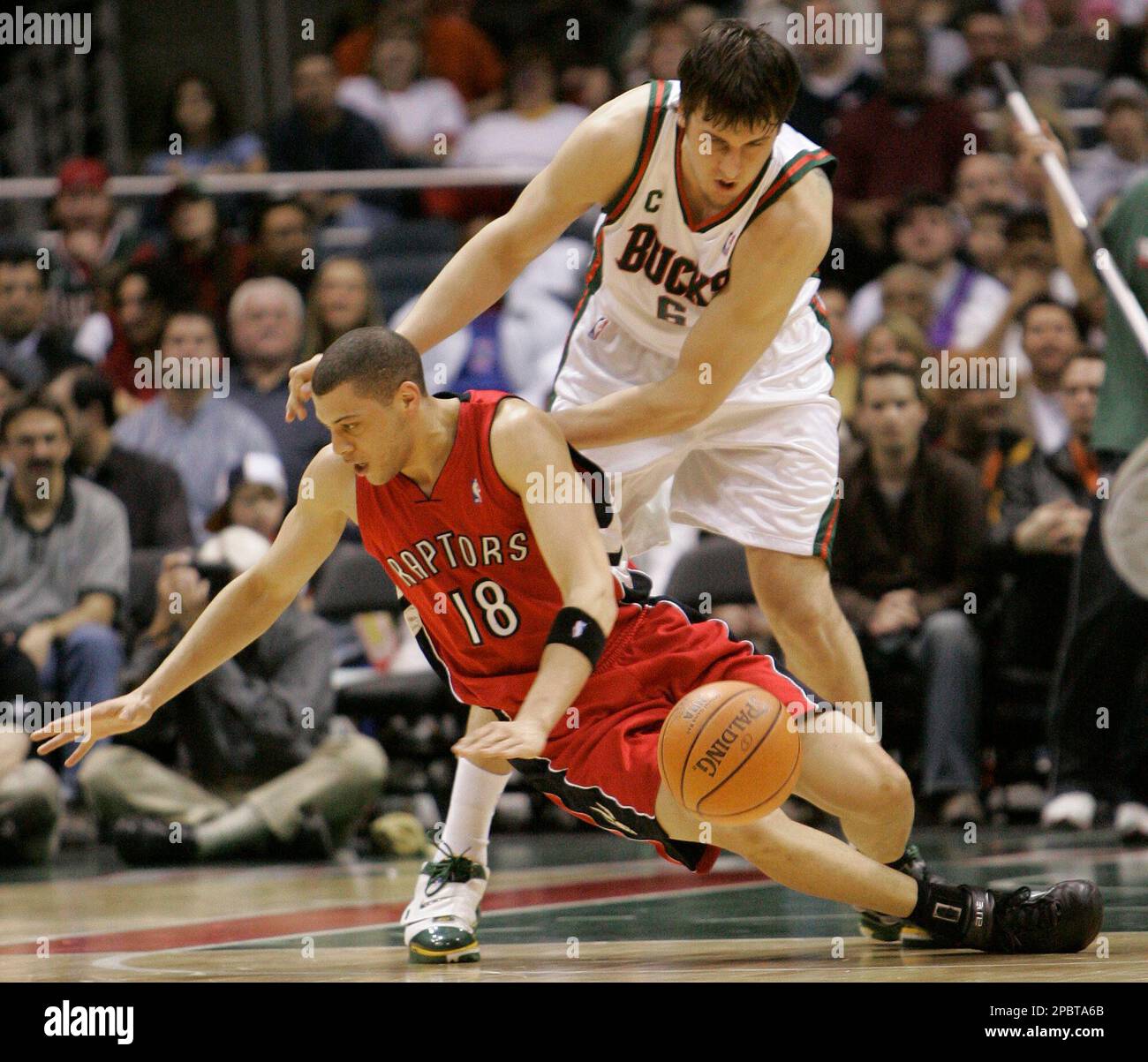 Milwaukee Bucks center Andrew Bogut, of Australia, fouls Toronto ...