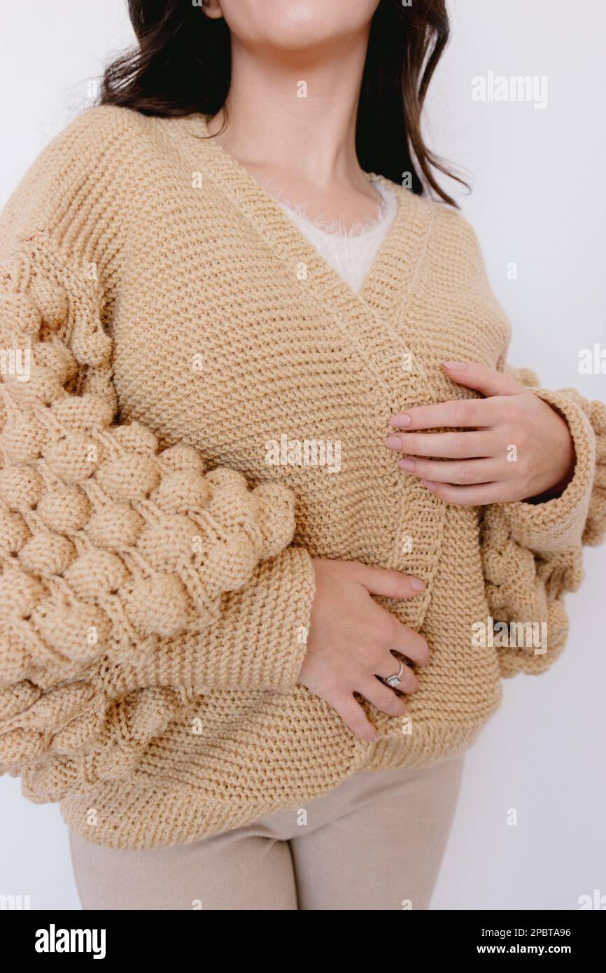 Cute girl wearing some knitted clothing Stock Photo - Alamy