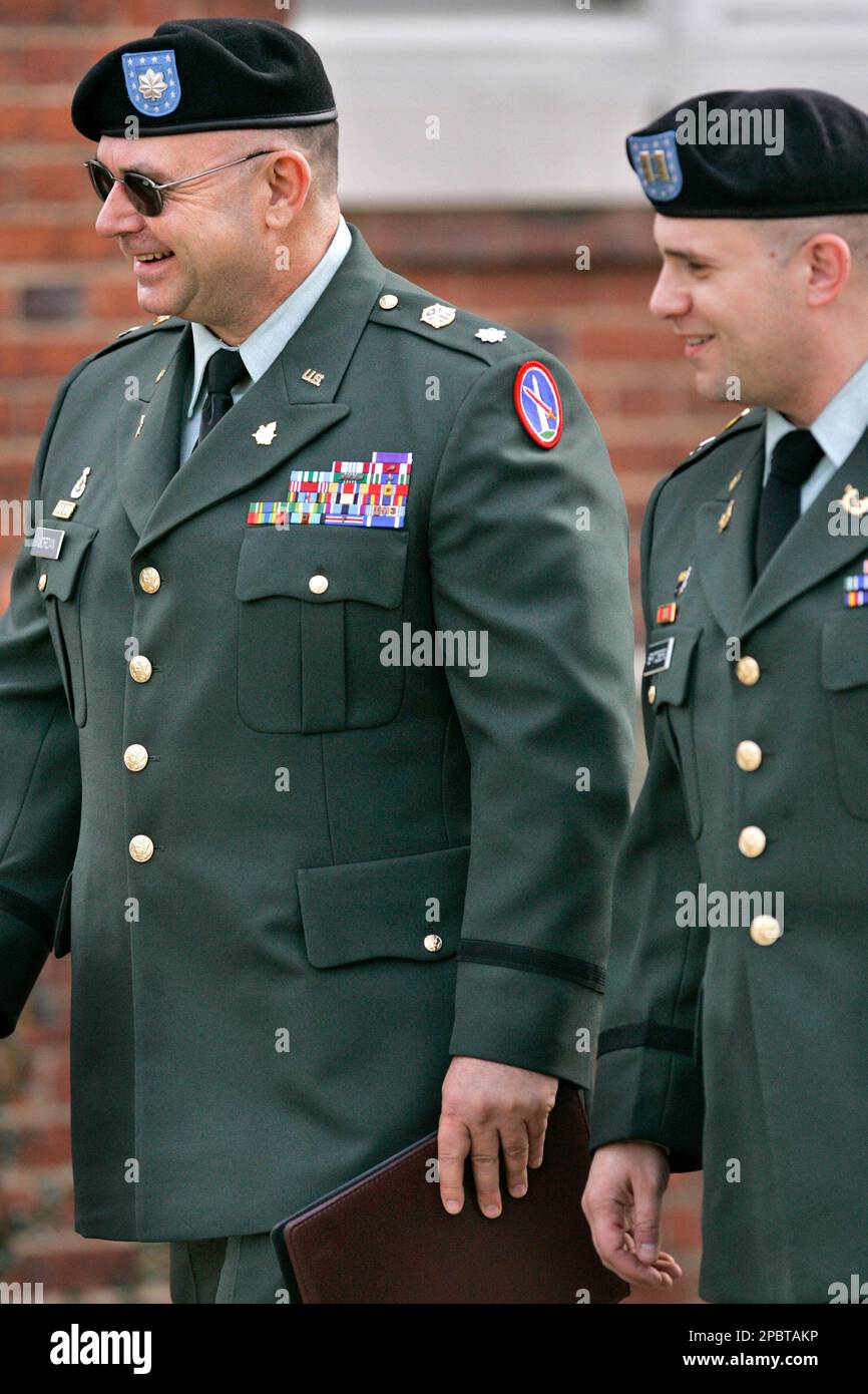 Lt. Col. Steven L. Jordan, left, leaves the military court with Capt ...