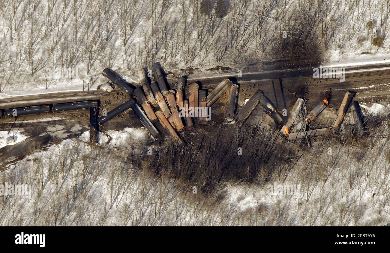 Cars from a freight train are strewn along railroad tracks in Oneida, N ...