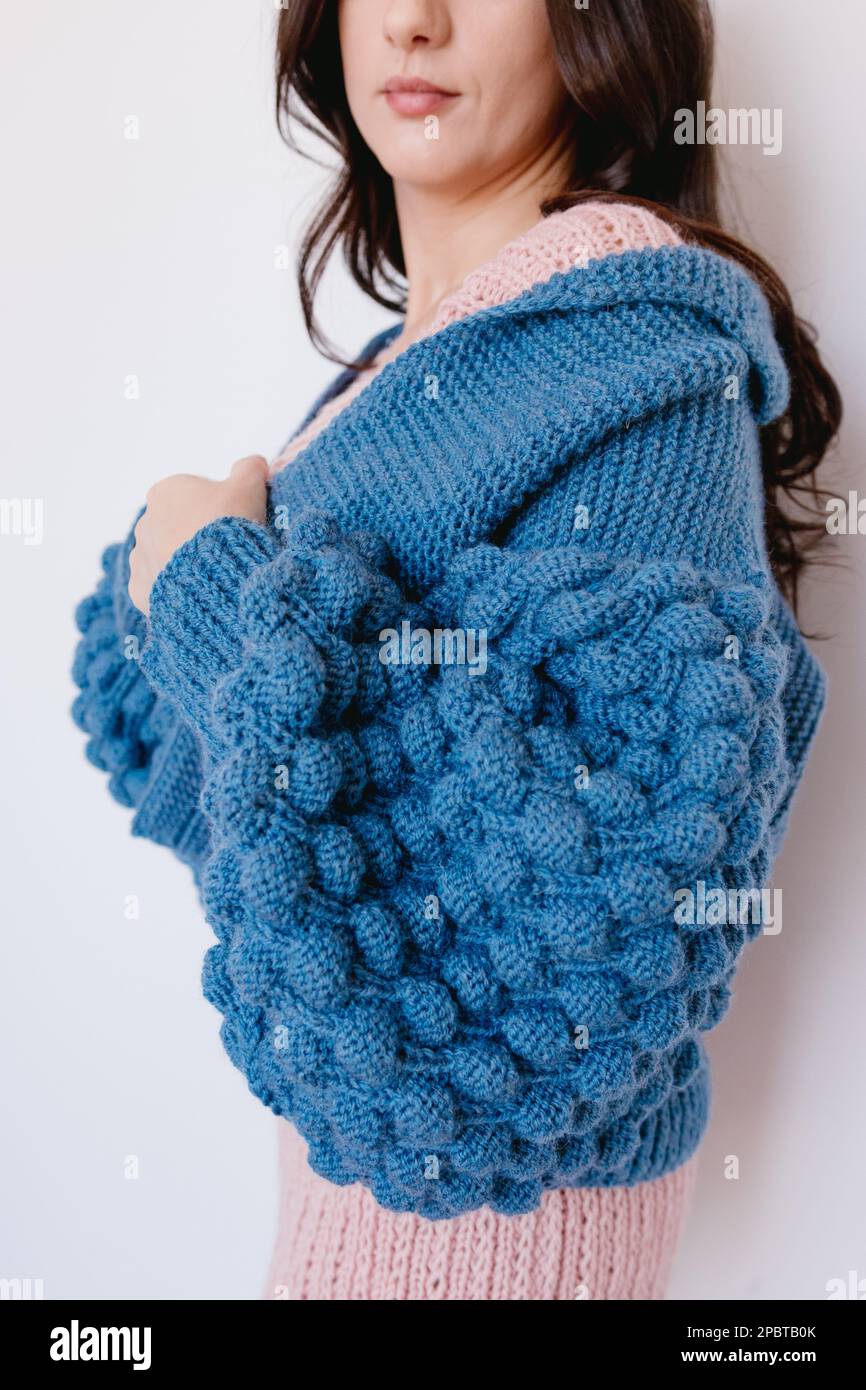 Cute girl wearing some knitted clothing Stock Photo - Alamy