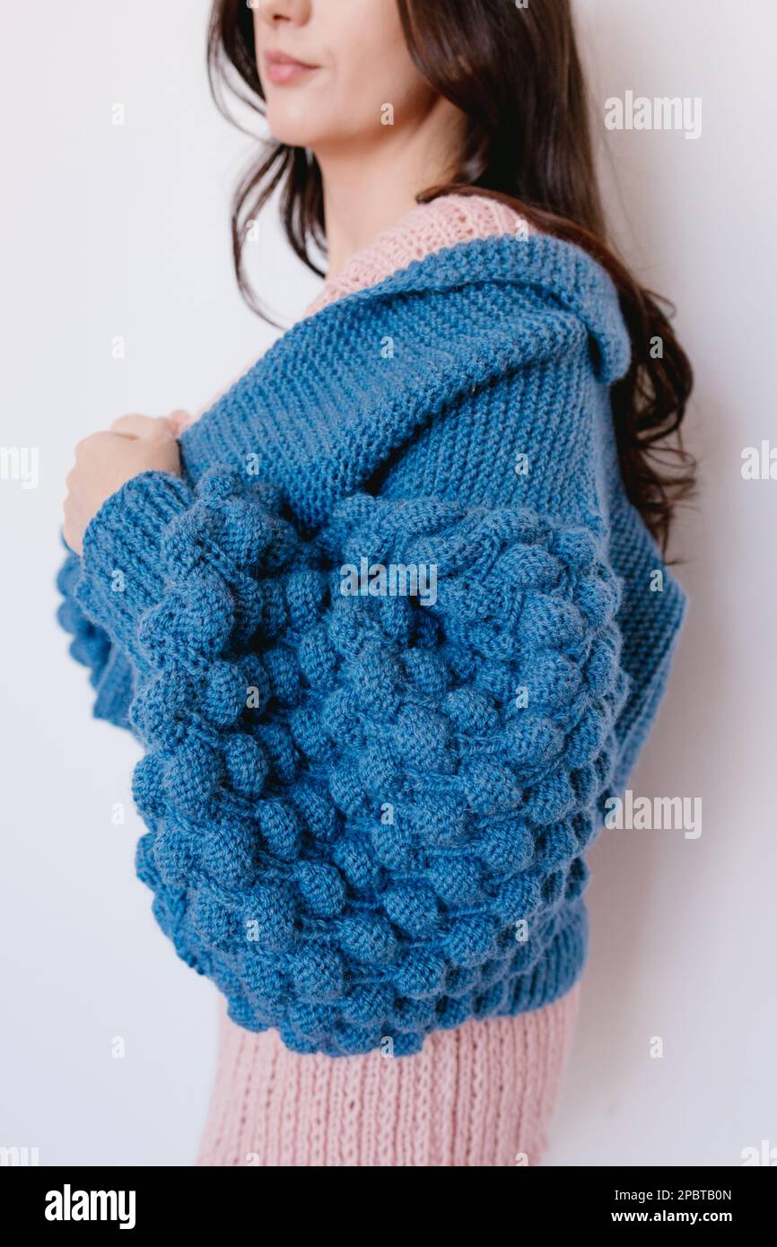 Cute girl wearing some knitted clothing Stock Photo - Alamy