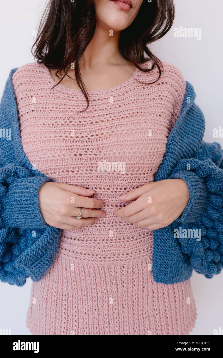 Cute girl wearing some knitted clothing Stock Photo - Alamy