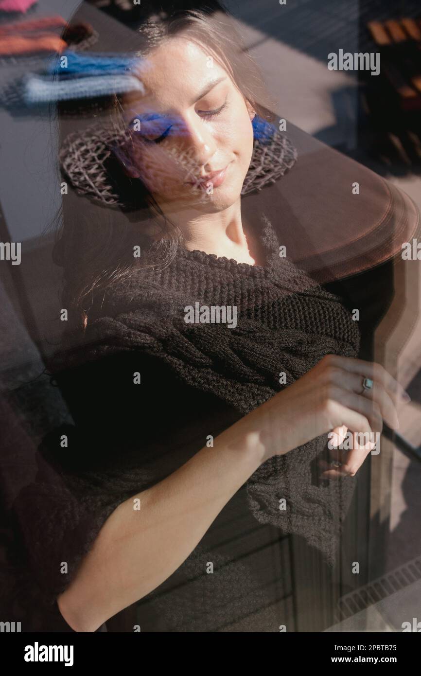 Cute girl wearing some knitted clothing Stock Photo - Alamy