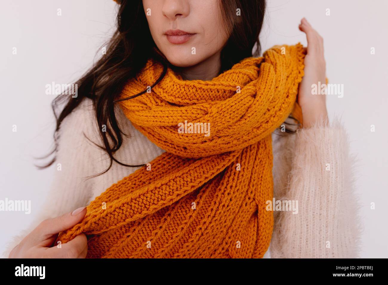 Cute girl wearing some knitted clothing Stock Photo - Alamy