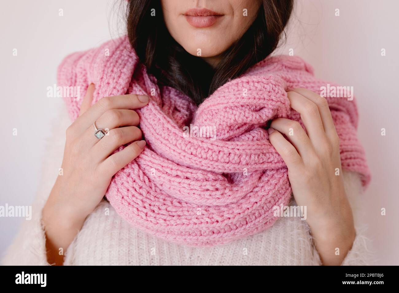 Cute girl wearing some knitted clothing Stock Photo - Alamy