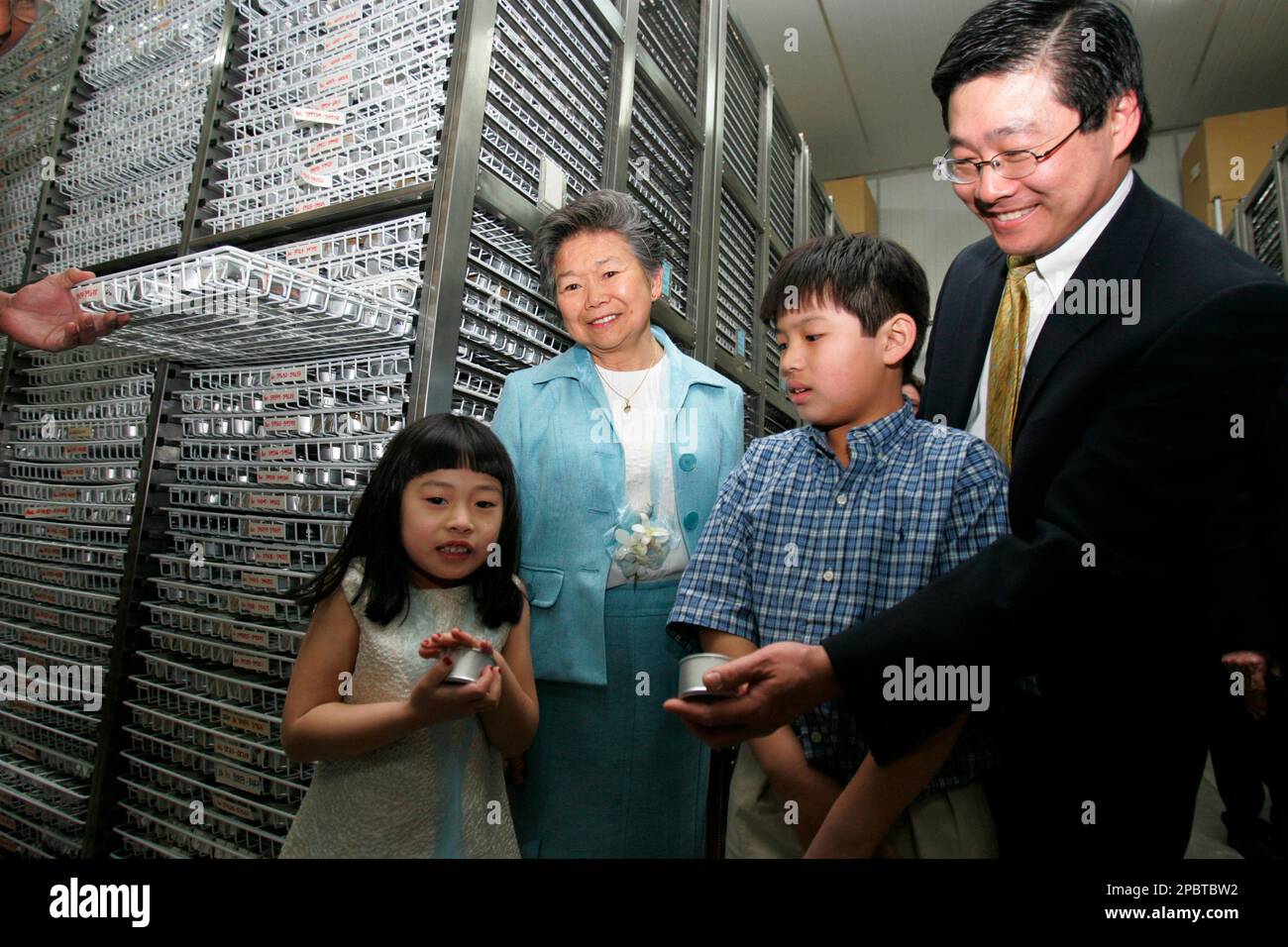 Nancy Chang, second from left, the widow of Dr. Te-Tzu Chang, whose ...