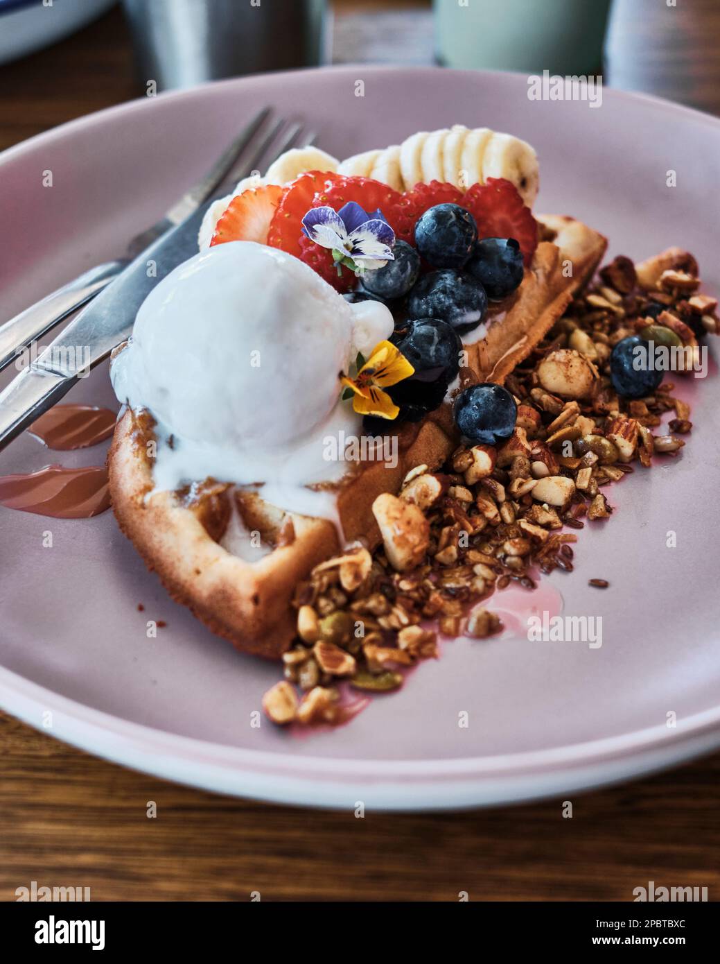 Breakfast waffle topped with tropical fruits and ice cream Stock Photo ...