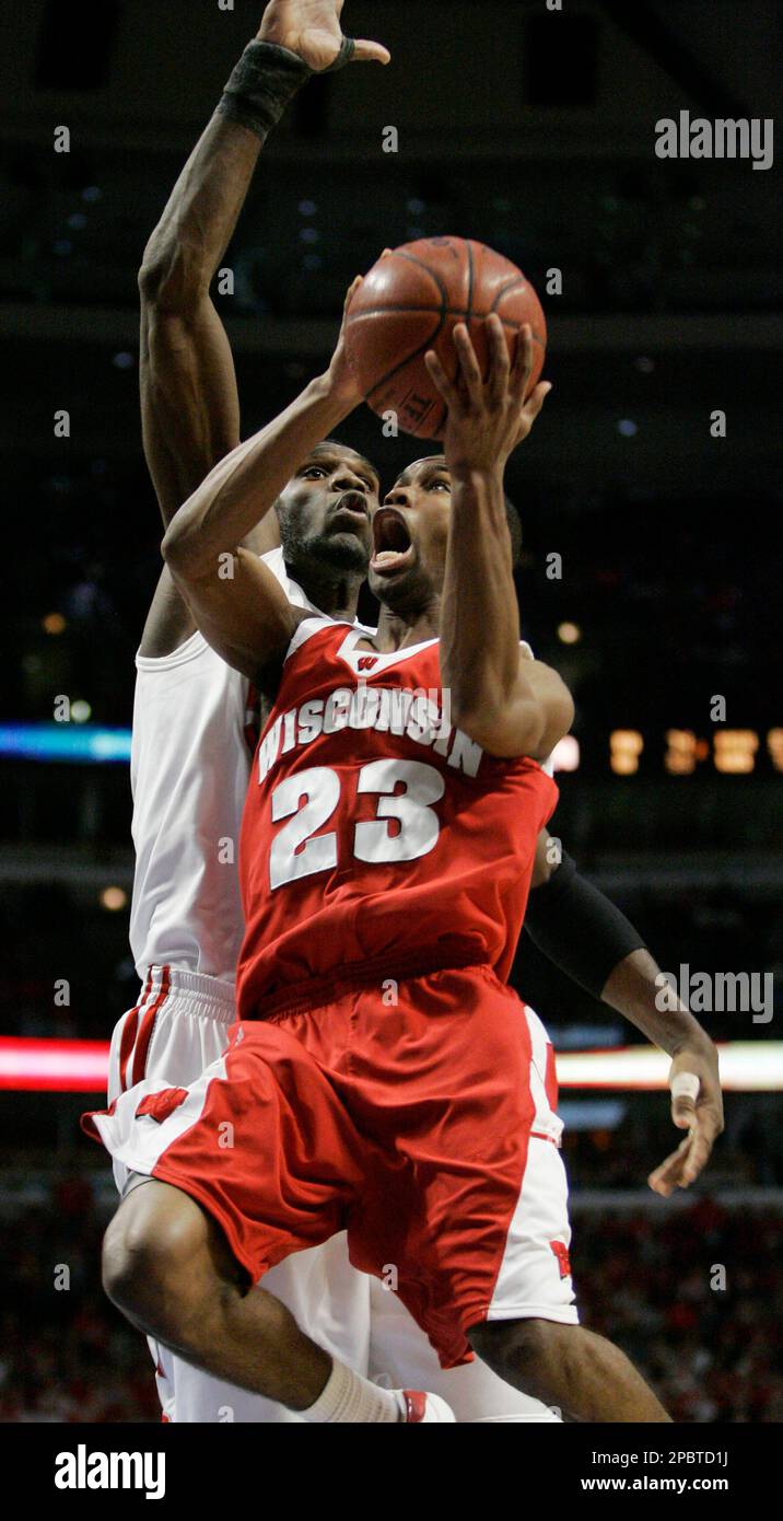 Ohio State center Greg Oden reaches up to block a shot by Wisconsin guard Kammron Taylor (23 ...